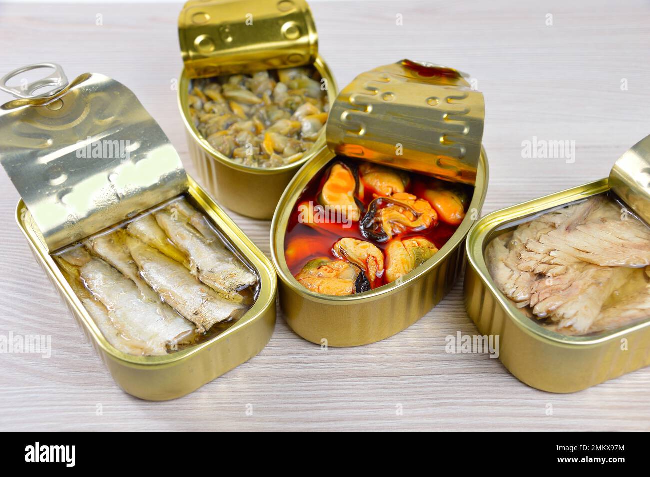 Assortment of cans of canned with different types of fish and seafood ...
