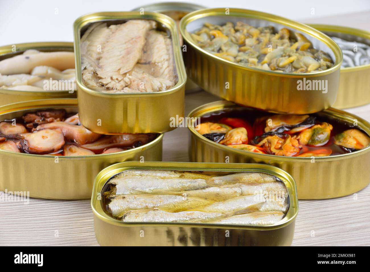 Assortment of cans of canned with different types of fish and seafood ...