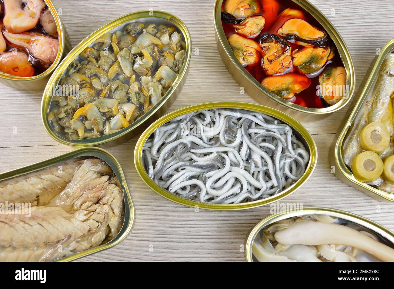 Assortment of cans of canned with different types of fish and seafood ...