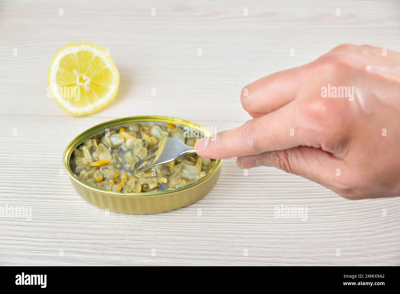 Man eating canned food hi-res stock photography and images - Alamy