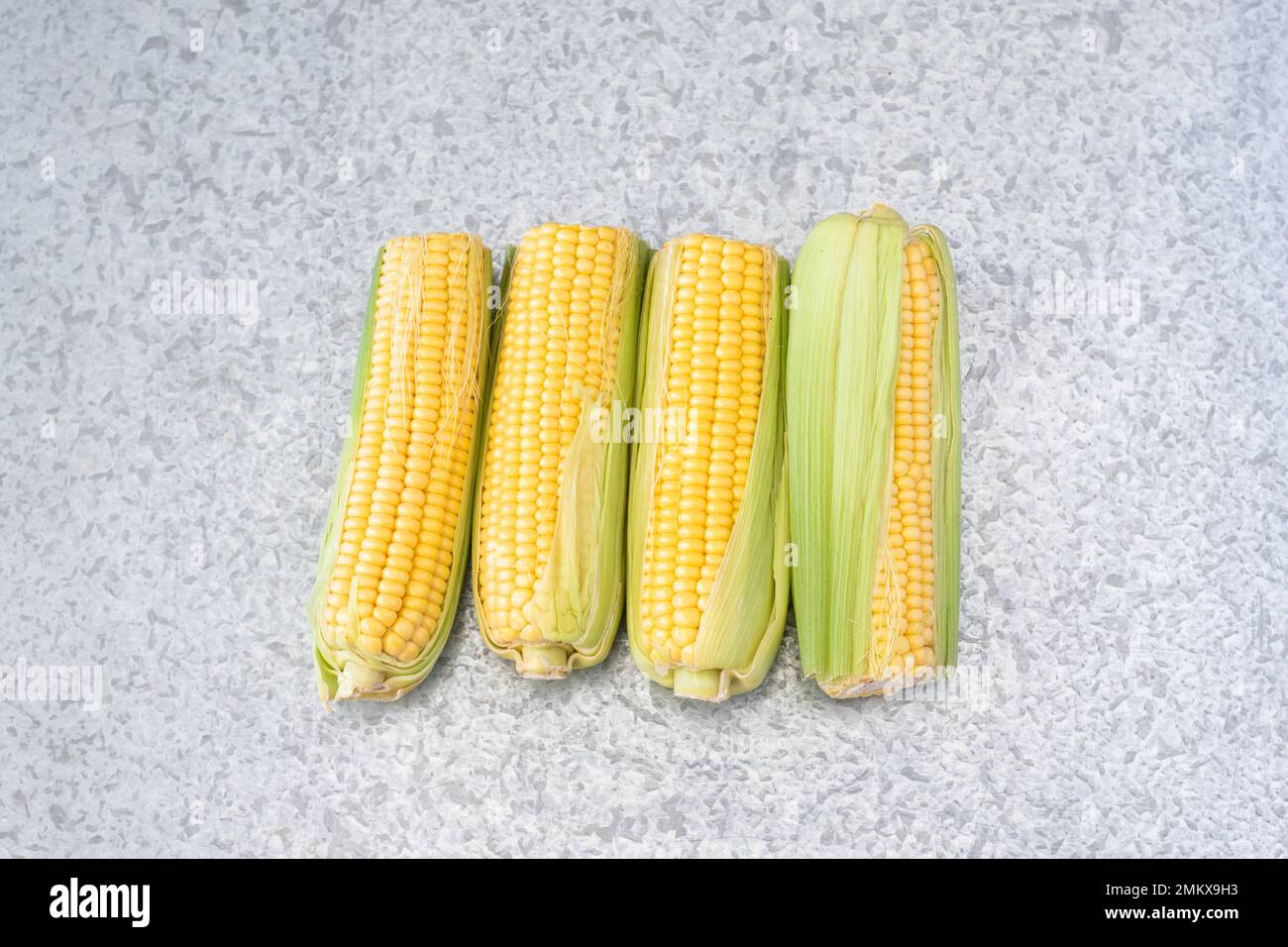 Four yellow corn cobs isolated, sweet corn Stock Photo - Alamy