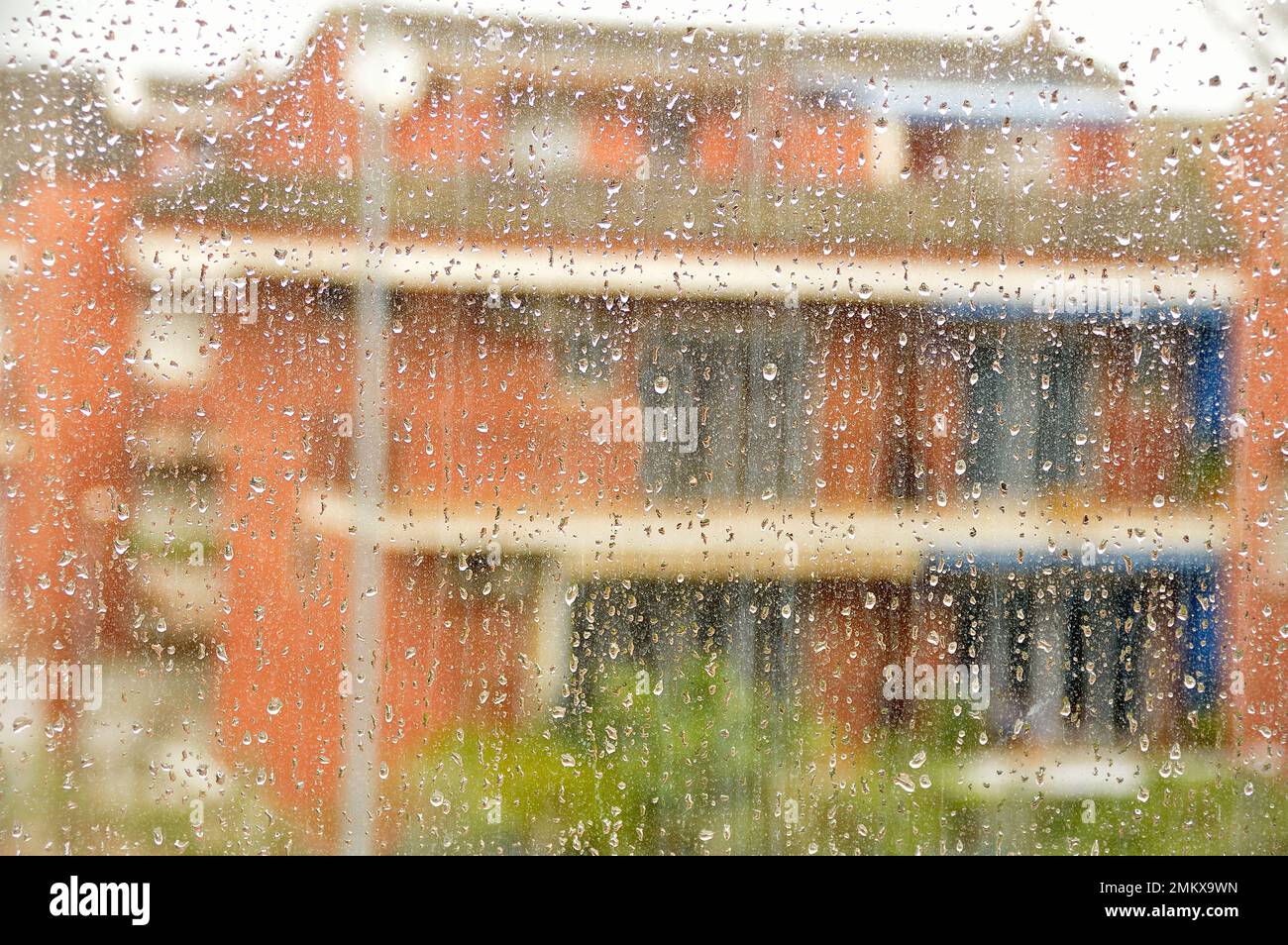 Water drops on glass with city background Stock Photo - Alamy