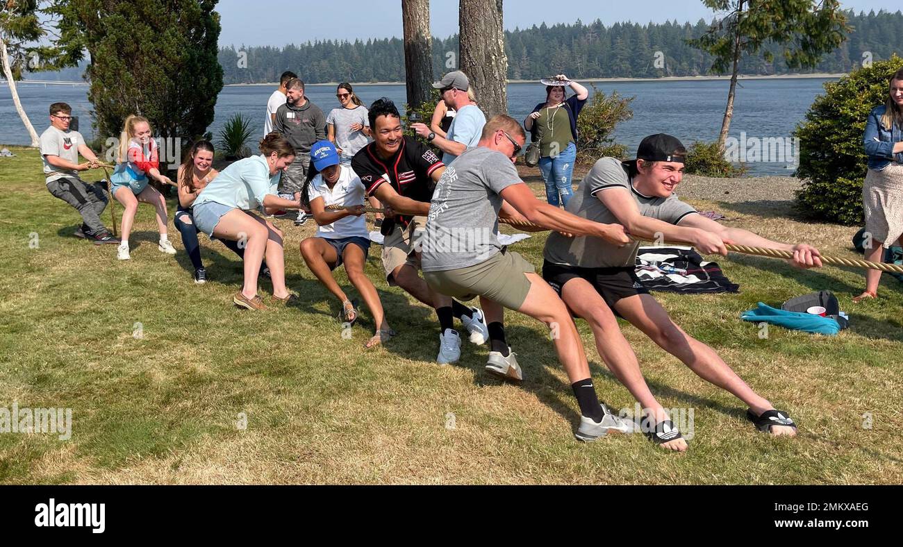 Service members compete in a game of tug of war during the 2022 ...