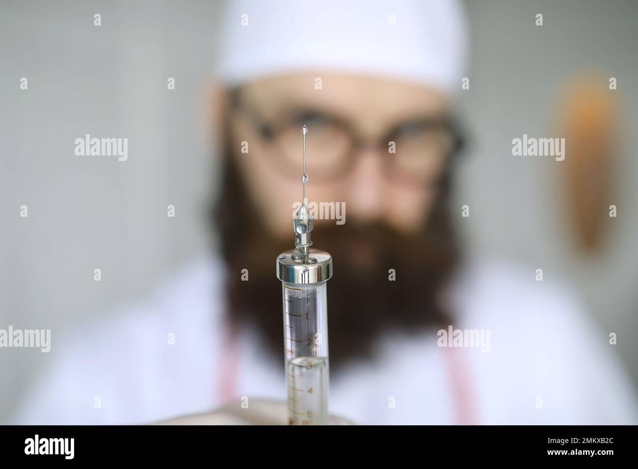 Doctor crazy. Mad beard scientist conducts experiments in a scientific ...
