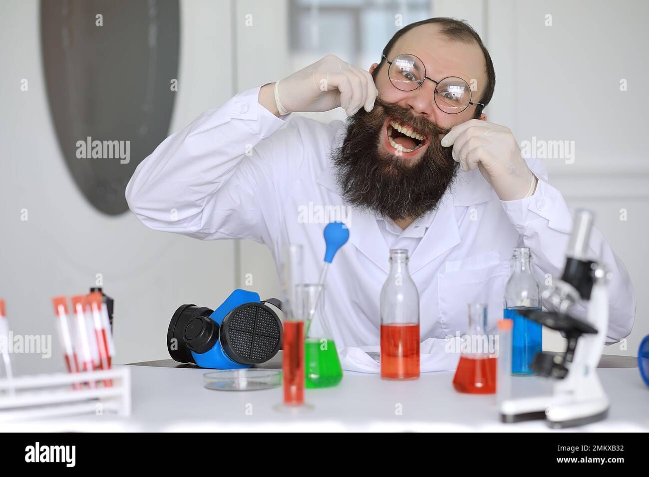 Chemist crazy. A mad scientist conducts experiments in scientific ...