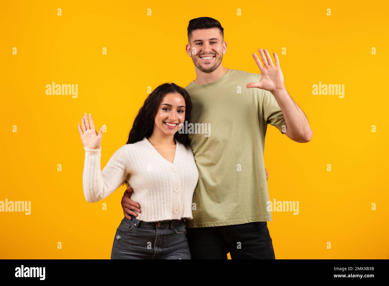 Cheerful arab woman waving hand hi-res stock photography and images - Alamy
