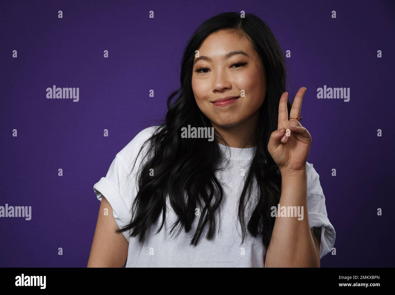 In this Dec. 5, 2018 photo, actress-rapper Awkwafina poses for a ...