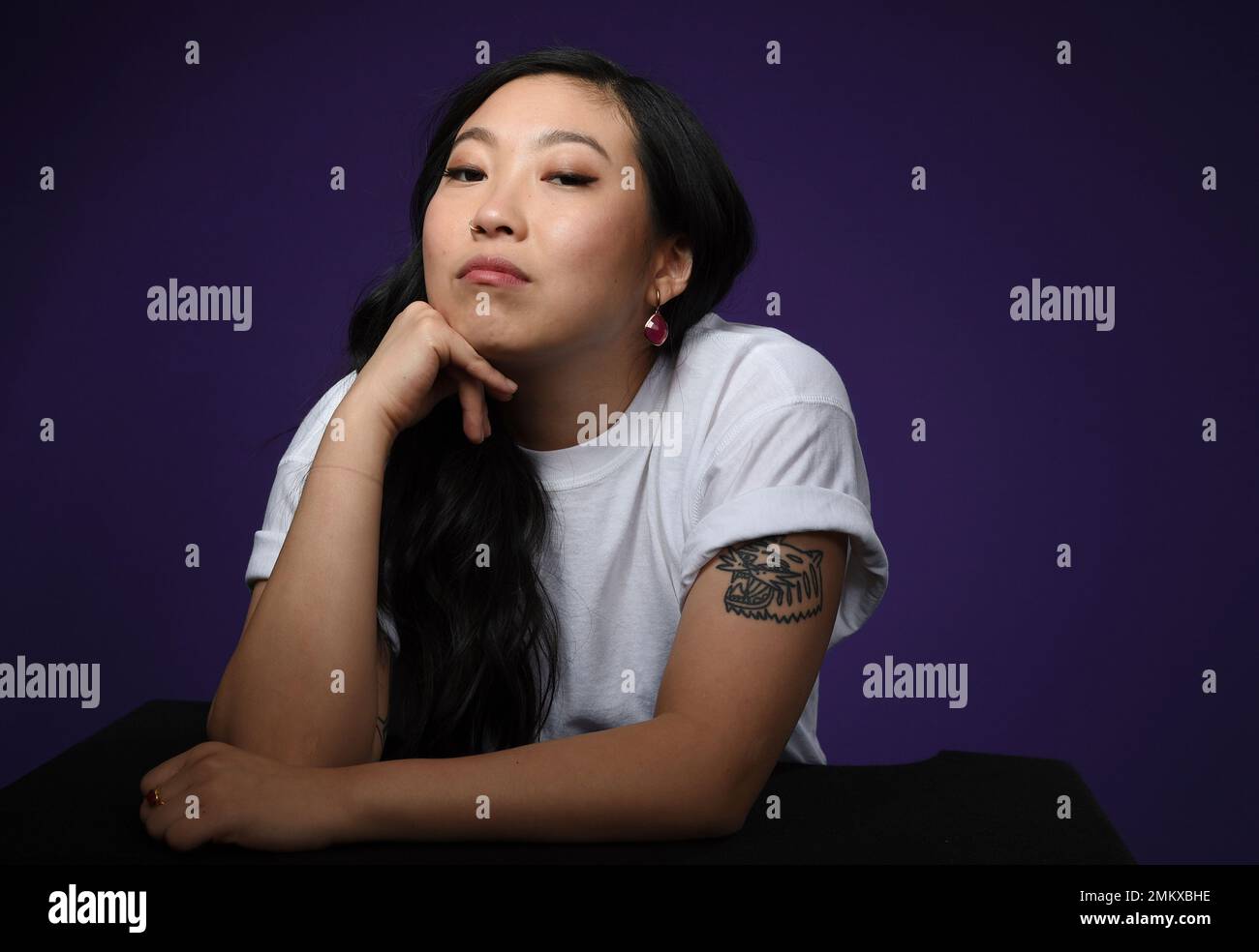 In this Dec. 5, 2018 photo, actress-rapper Awkwafina poses for a ...