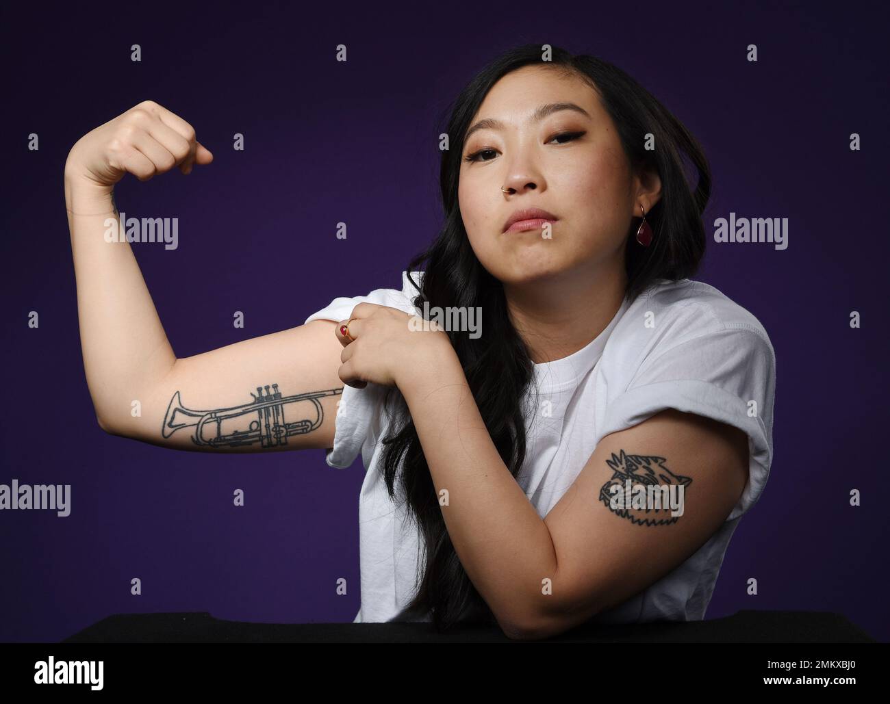 In this Dec. 5, 2018 photo, actress-rapper Awkwafina poses for a ...