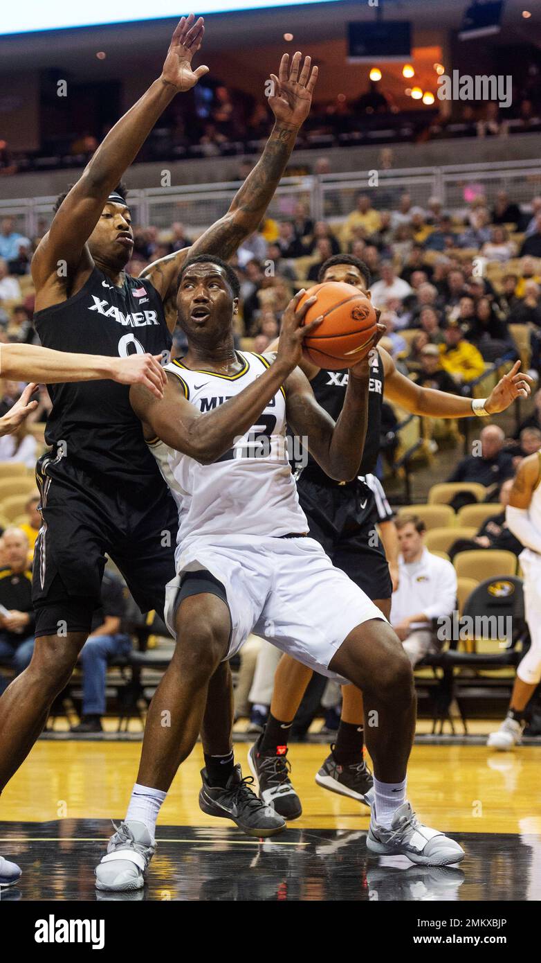 Missouri's Jeremiah Tilmon, center, tries to shoot between Xavier's ...