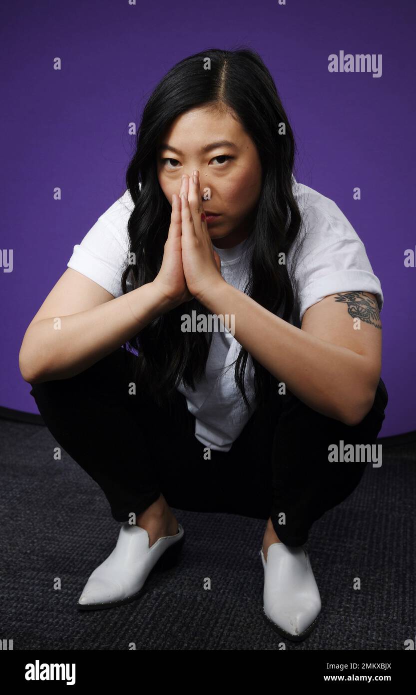 In this Dec. 5, 2018 photo, actress-rapper Awkwafina poses for a ...