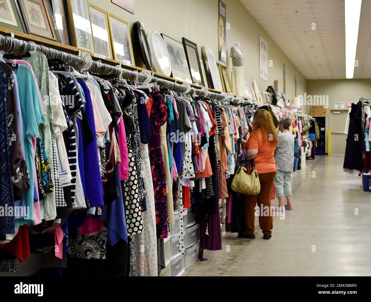 Fort Polk Thrift Shop patrons search through the Women's Apparel ...