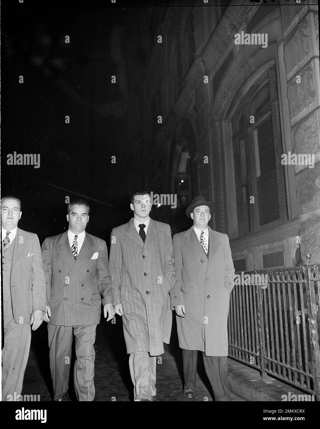 Ralph Edward Barrows, 19-year-old salesman, center, leaves the East ...