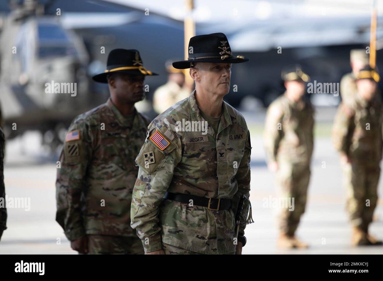 Col. Jaeger (foreground) and Command Sgt. Maj. Murphy stand at the ...