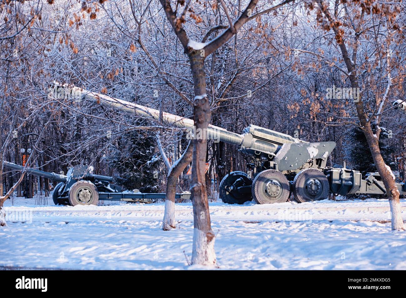 Military tank in a row. Battle tank in the snow on the roadside of ...