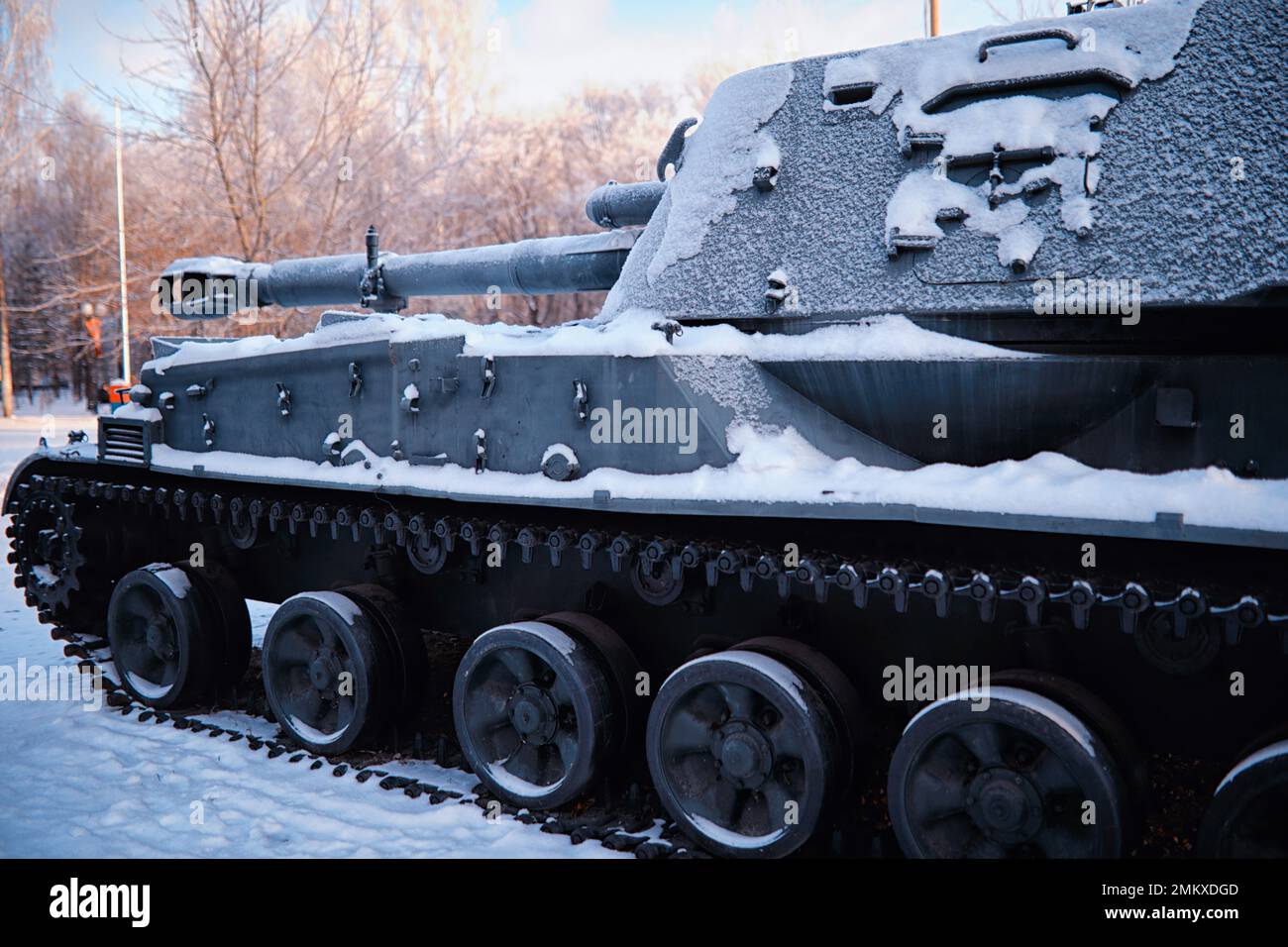 Military tank in a row. Battle tank in the snow on the roadside of ...