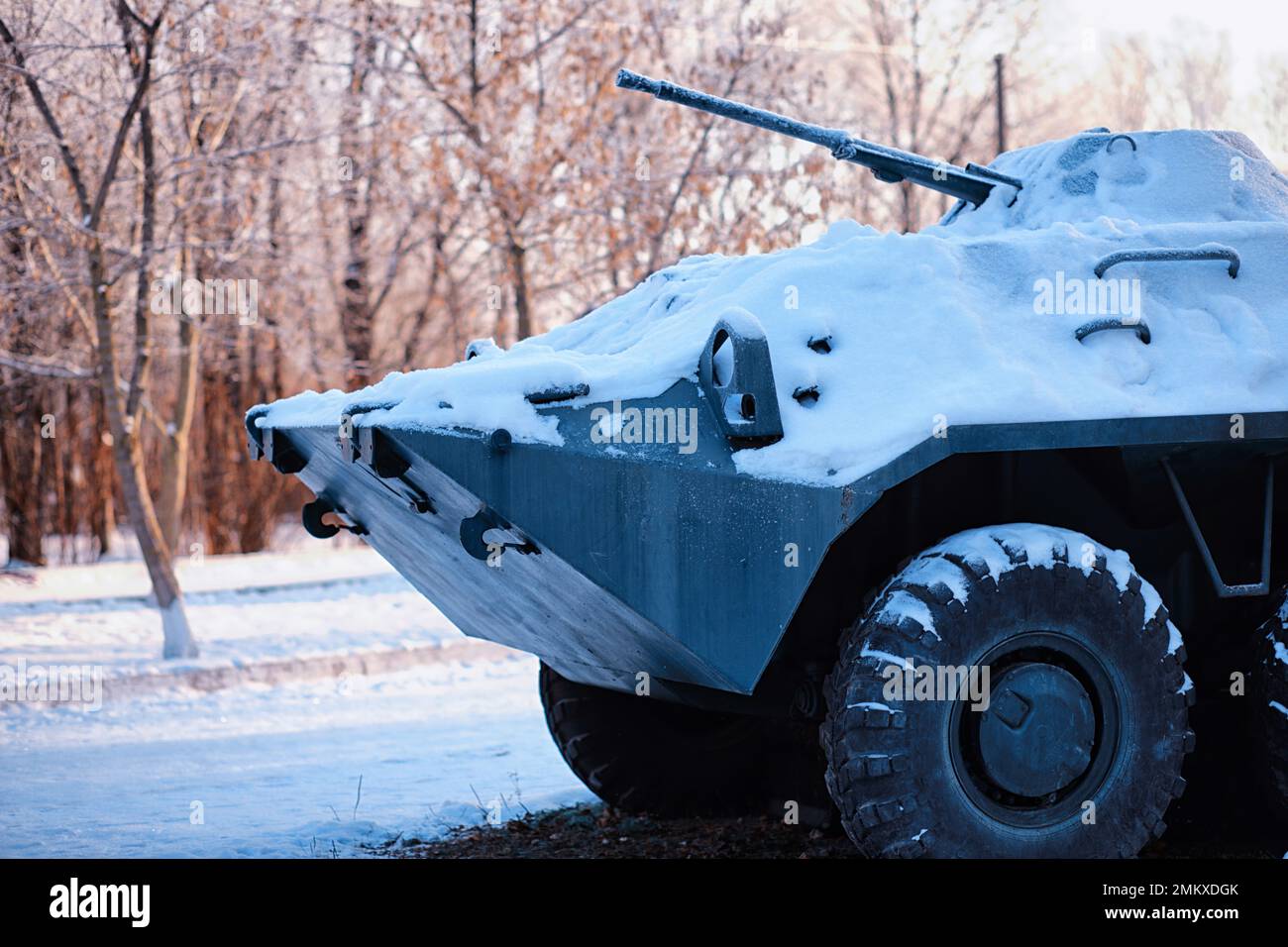 Military tank in a row. Battle tank in the snow on the roadside of ...
