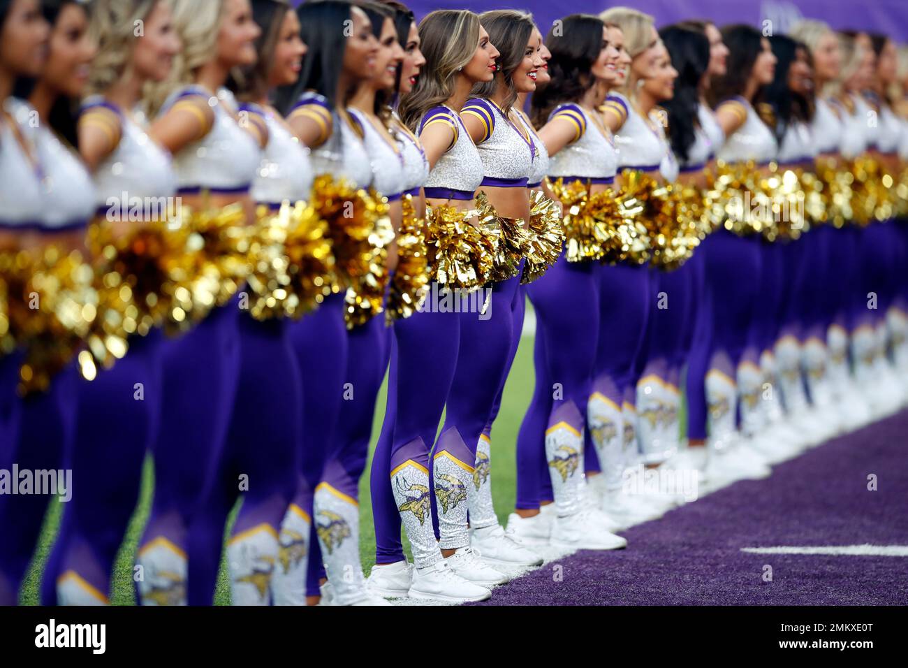 The Minnesota Vikings cheerleaders stand during the national anthem at ...