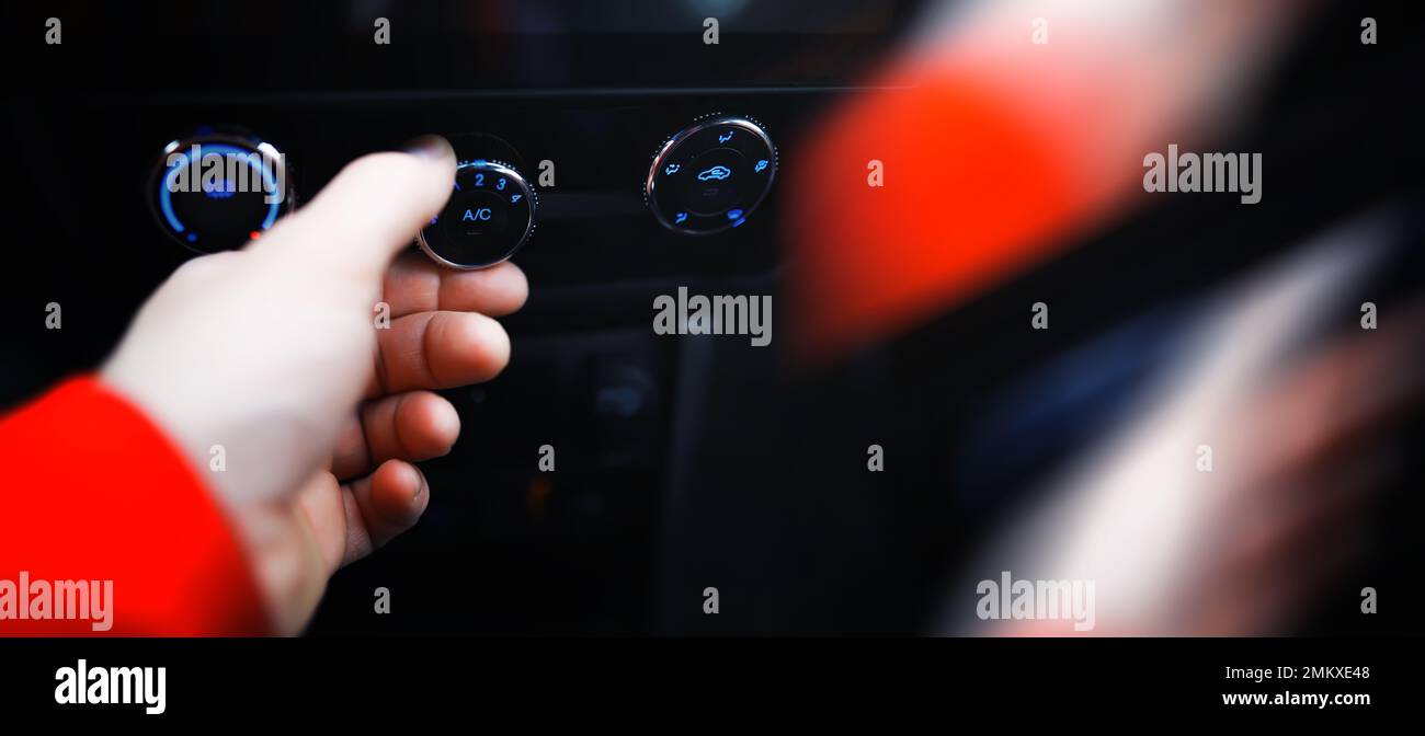 The process of choosing climate control in the car. Man regulating ...