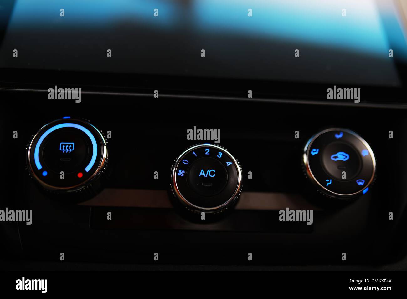 The process of choosing climate control in the car. Man regulating ...