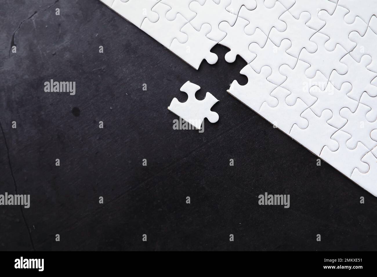 Intellectual puzzles. The puzzle empty. The hand puts together puzzle ...