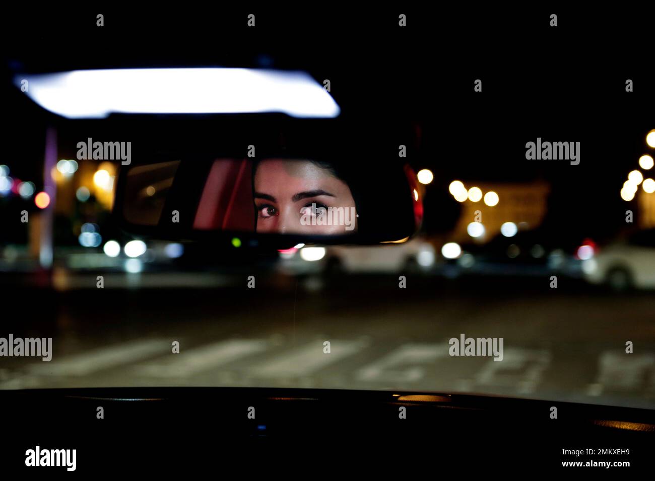 Hessah al-Ajaji drives her car down the capital's busy Tahlia Street ...