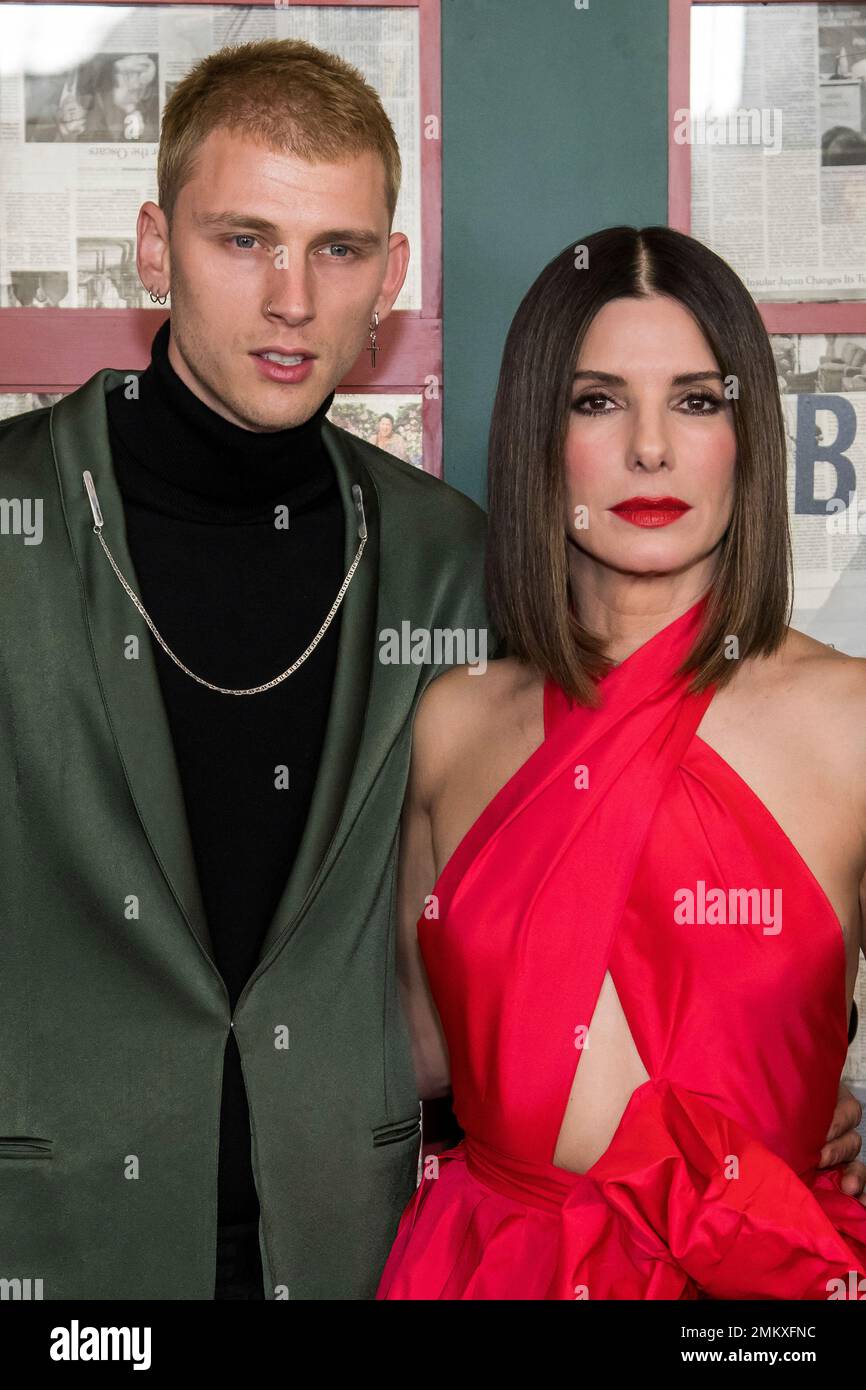 Colson Baker, also known as Machine Gun Kelly, and Sandra Bullock ...