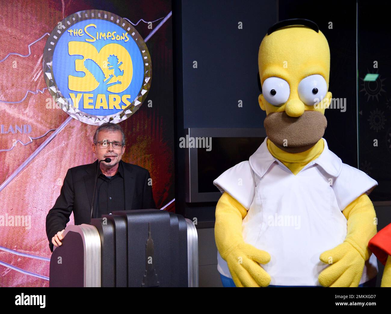 Producer Mike Scully, left, appears with costumed character Homer ...