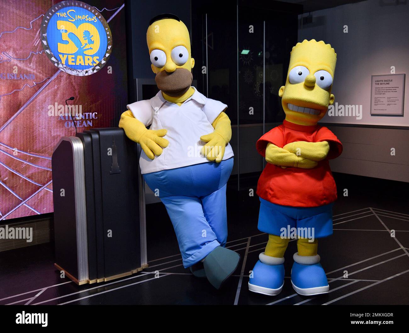 Costume characters Homer Simpson, left, and Bart Simpson pose at Fox's ...