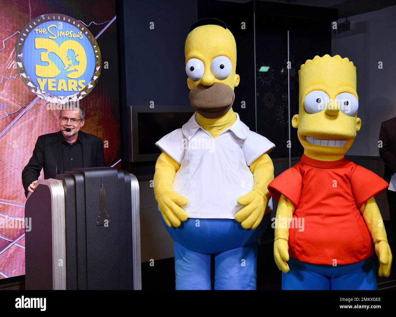 Producer Mike Scully, left, appears with costumed characters Homer ...