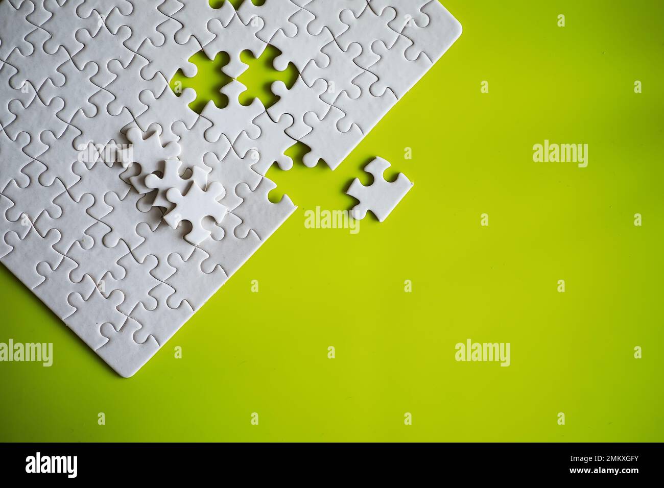 Clean puzzle elements on the background. Empty puzzle piece on table ...