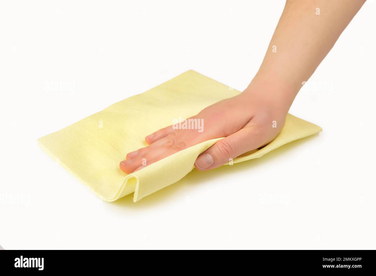 Hand wiping surface with yellow rag isolated on white Stock Photo - Alamy