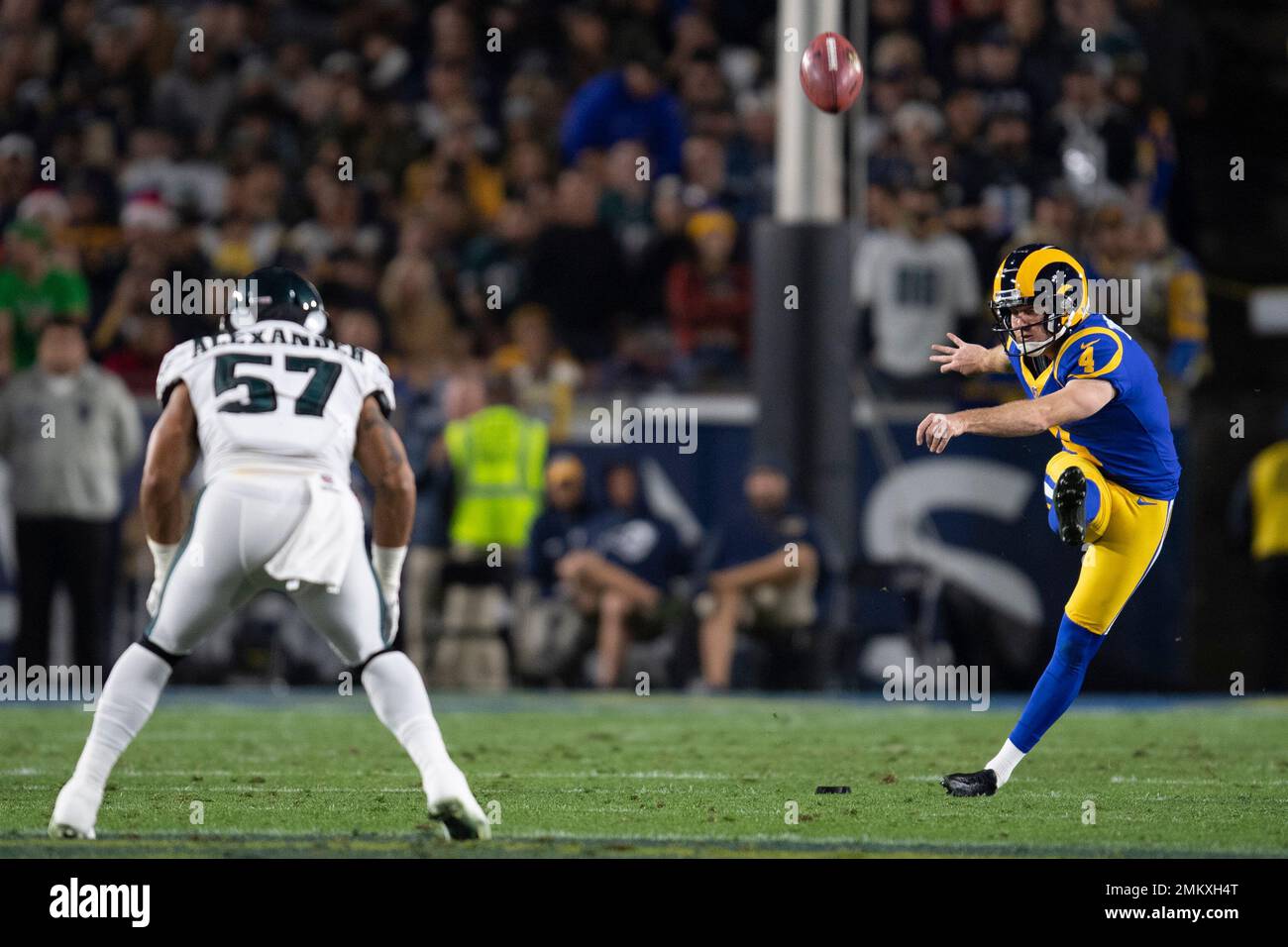 Los Angeles Rams kicker Greg Zuerlein, right, kicks off in an NFL ...