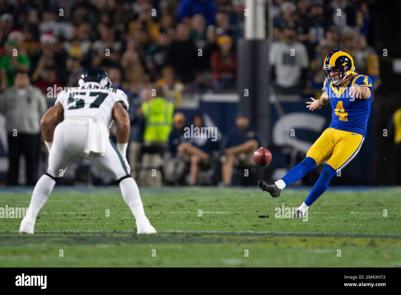 Los Angeles Rams kicker Greg Zuerlein, right, kicks off in an NFL ...