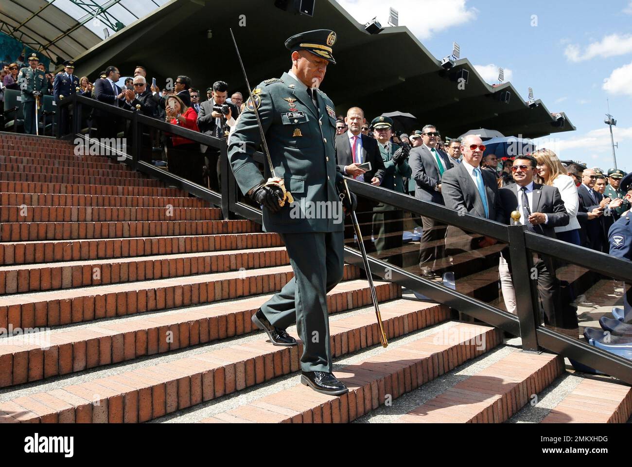 Armed Forces Commander Gen. Luis Navarro descends a flight of stairs ...