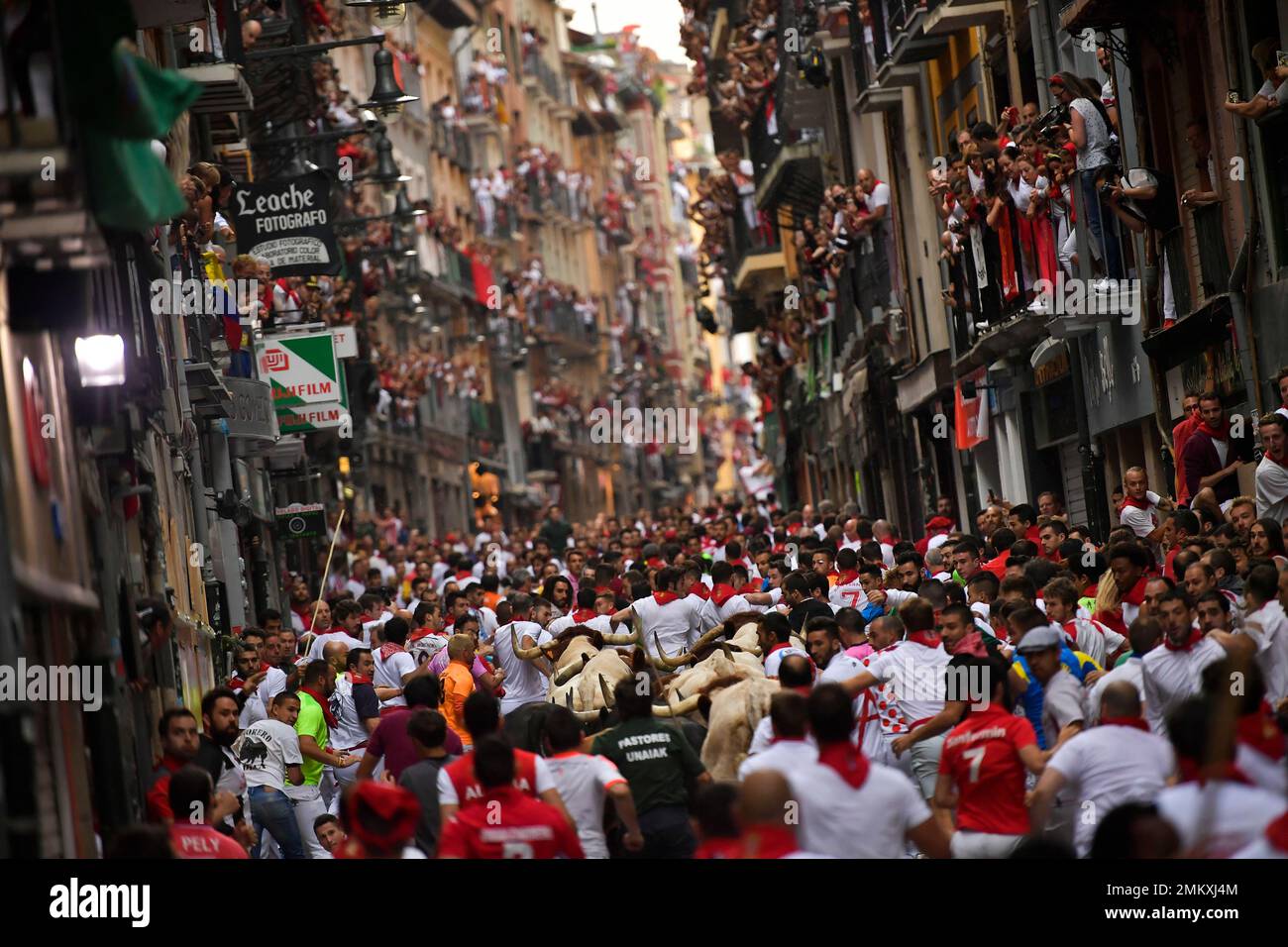 FILE - In this Thursday, July 12, 2018 file photo revellers run next to ...