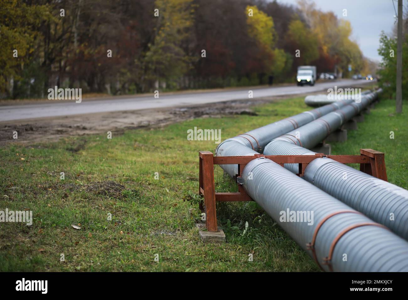 Metal pipes on the street. pipes from the pipeline. gas pipeline for ...