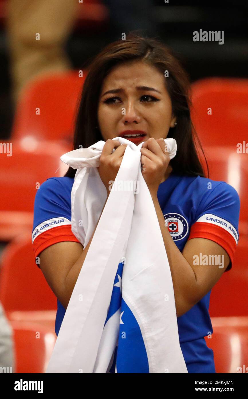A Cruz Azul fan reacts after his team lost to America during the final ...