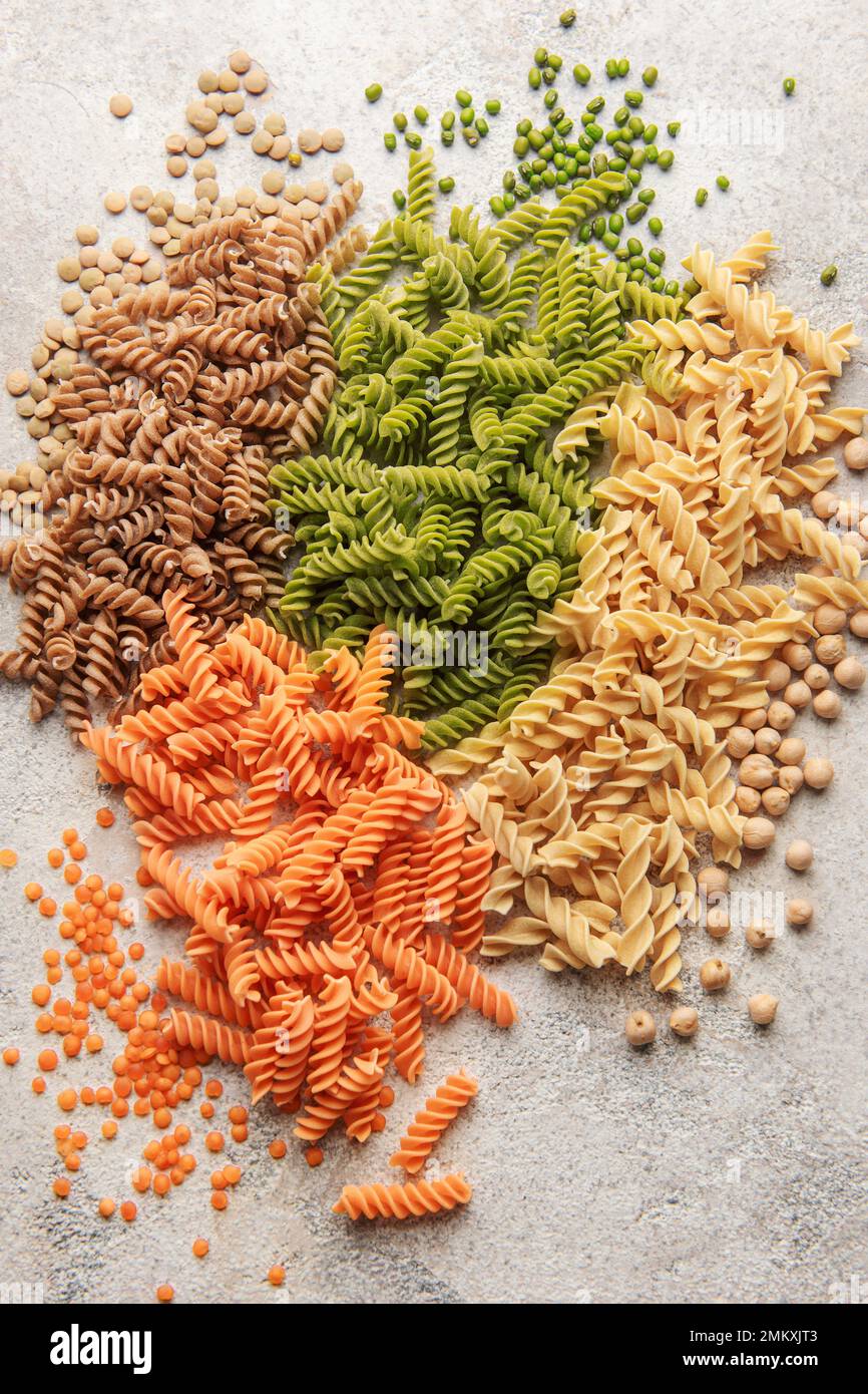 A variety of fusilli pasta made from different types of legumes, green ...