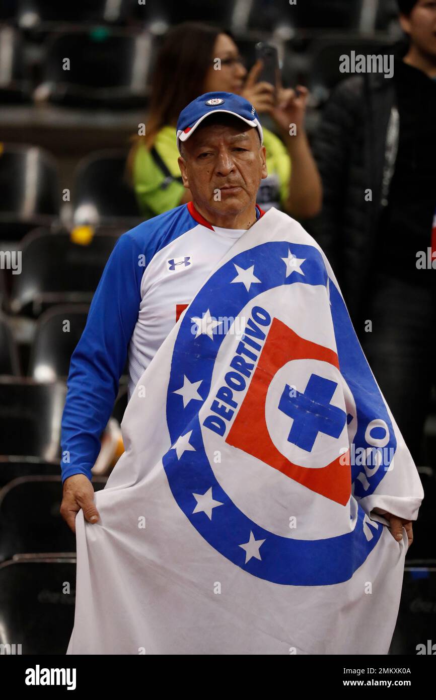 A Cruz Azul fan reacts after his team lost to America during the final ...
