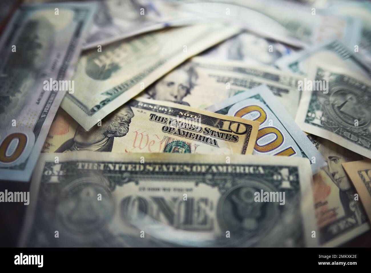 Cash money in a large pile as a finance background. Paper money close ...