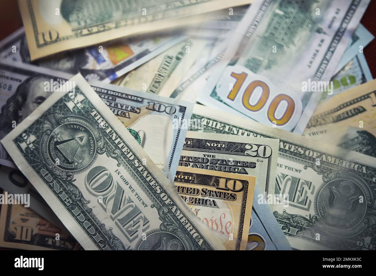 Cash money in a large pile as a finance background. Paper money close ...