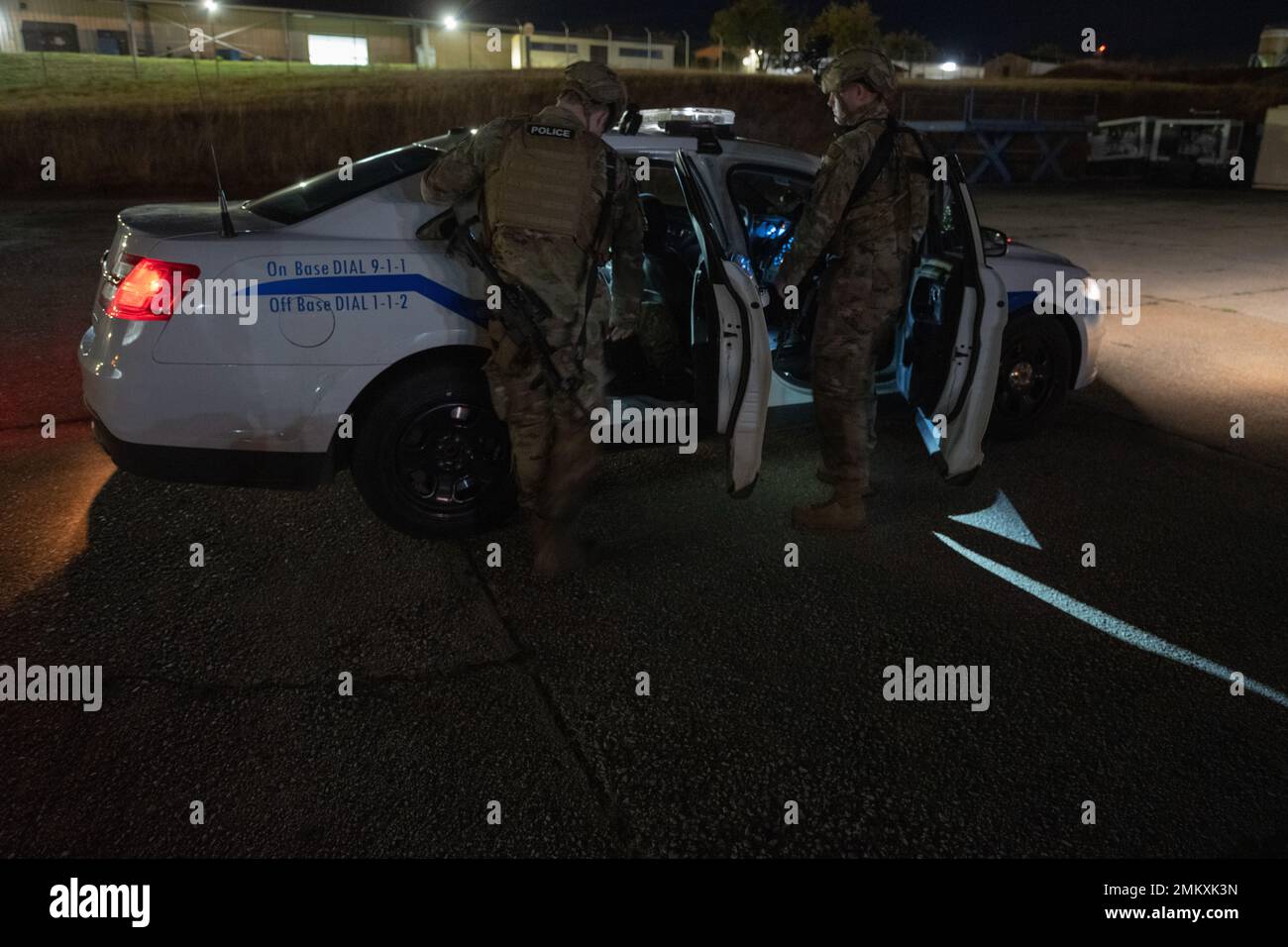 Airman 1st Class Kyle Smotherman, left, assigned to the 47th Security ...