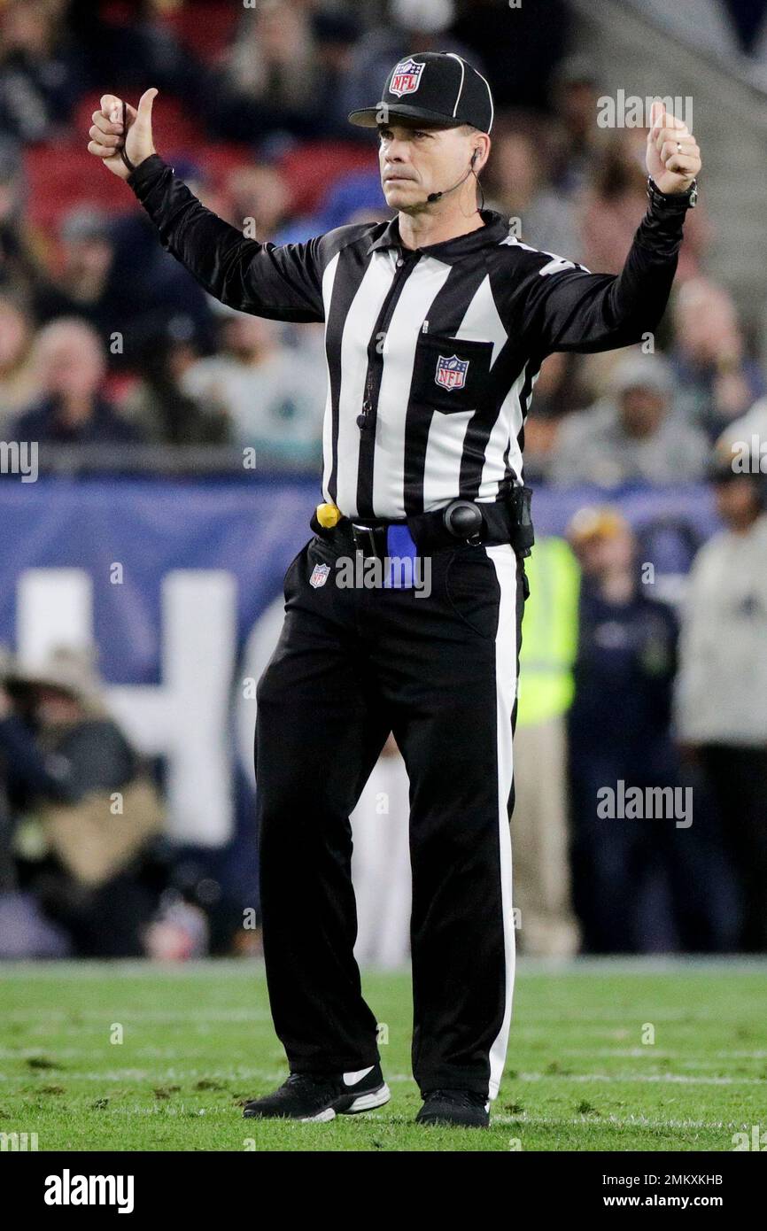 Official, referee Terry McAulay (77) makes a call during the first half ...