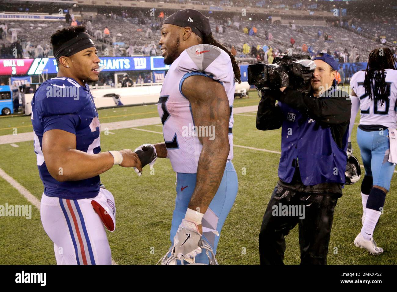 New York Giants running back Saquon Barkley, left, talks to Tennessee ...