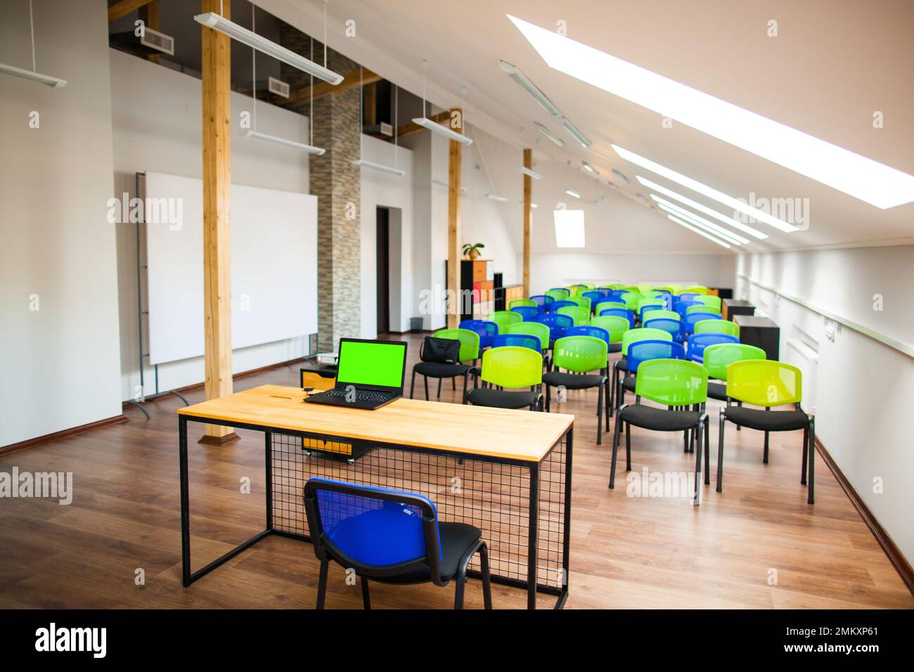 modern lecture room with with colored chairs and interesting design ...