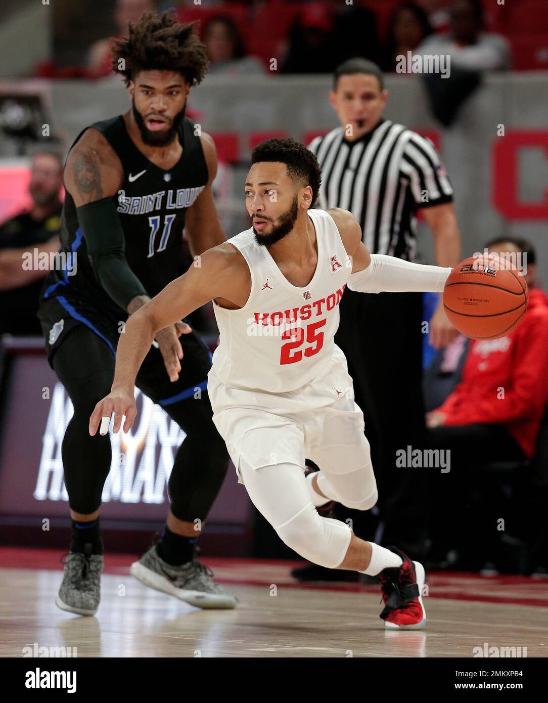 Houston guard Galen Robinson Jr. (25) drives around Saint Louis forward ...