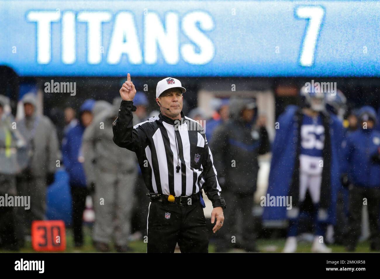 NFL official Shawn Hochuli, a referee, gestures during the second half ...