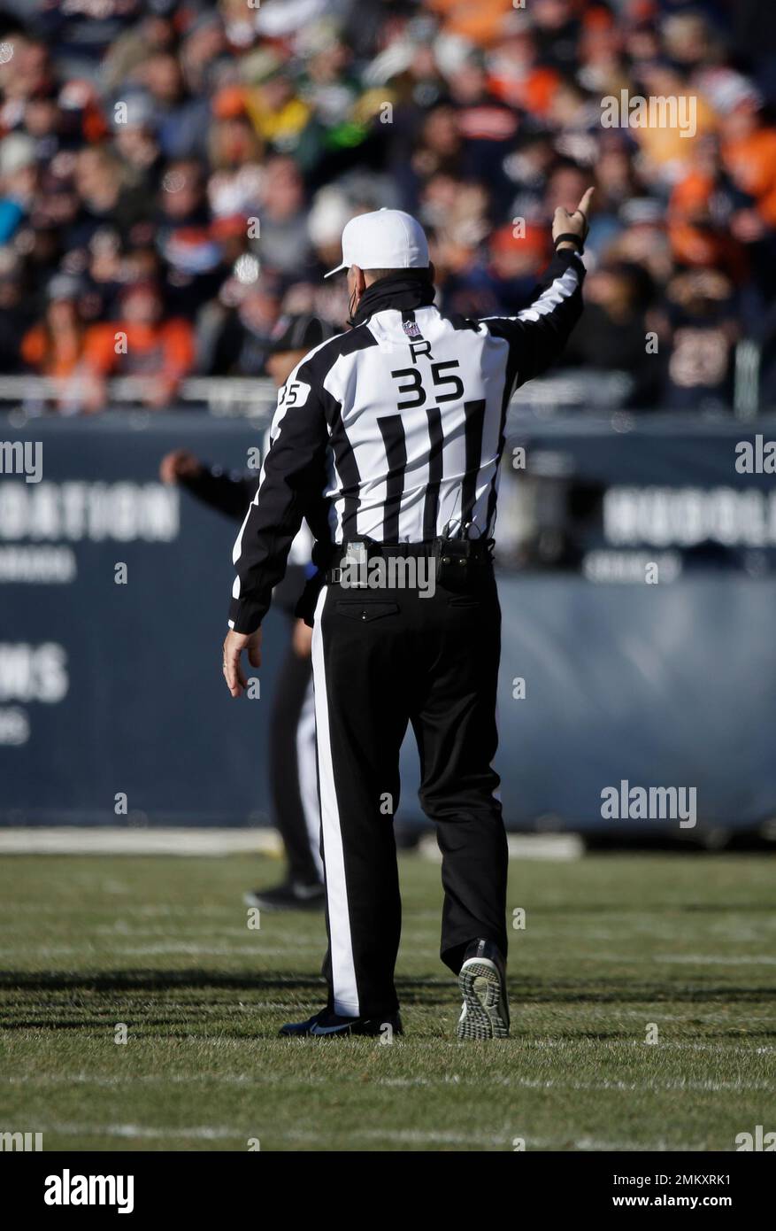 Referee John Hussey (35) signals during the second half of an NFL ...