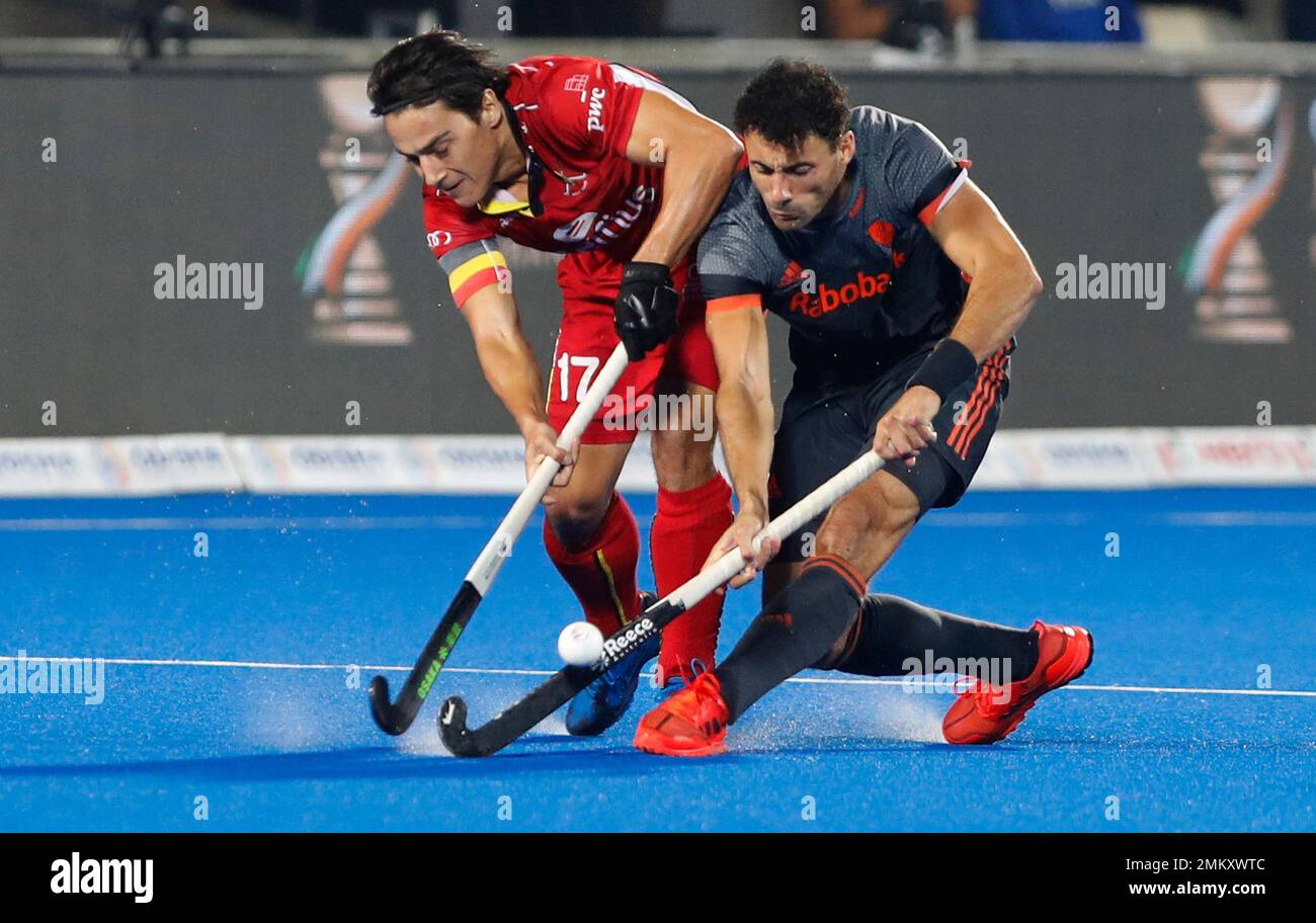 Belgium's captain Thomas Briels, left, fights to take control of the ...